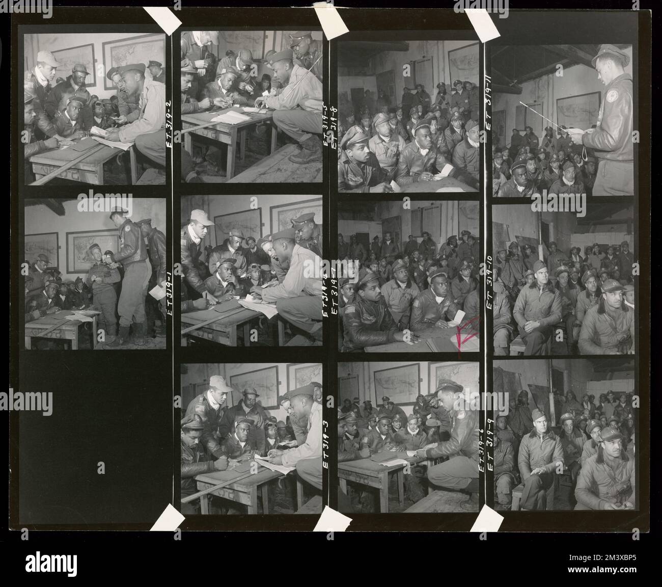 Members of the Army Air Force 332nd Fighter Group in a briefing room ...
