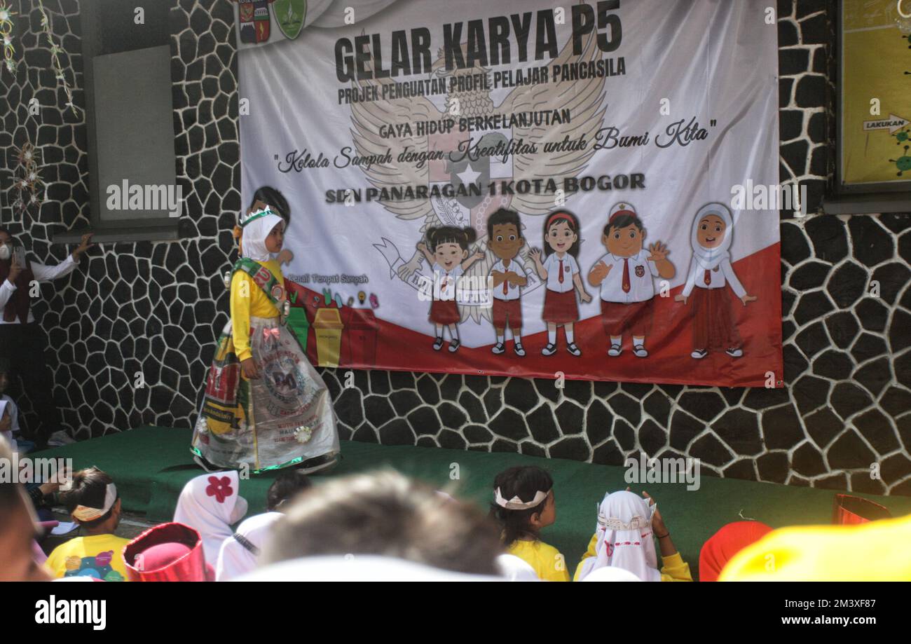 A student wearing plastic waste costume during participates sustainable ...