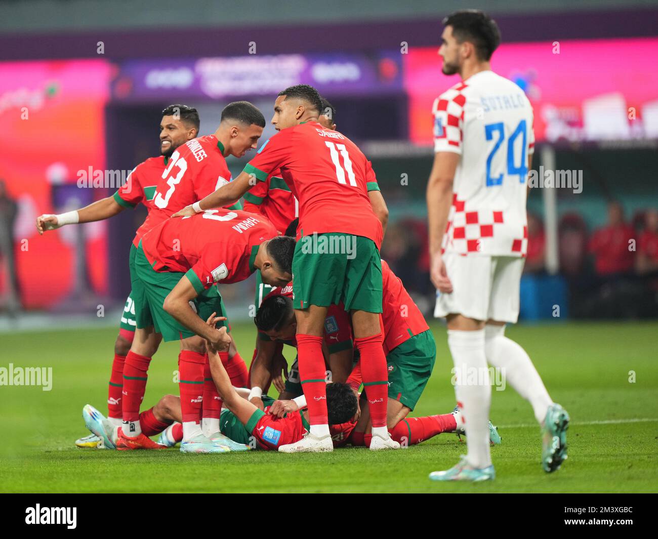 Achraf Dari of Morocco celebrates his goal with his teammates during ...