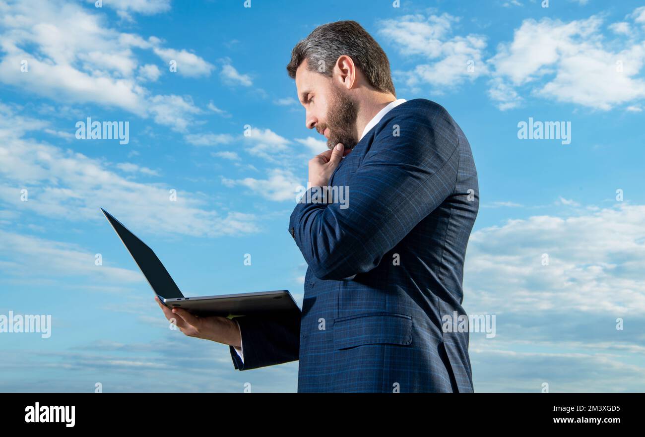 caucasian business man freelancing on sky background. business man ...