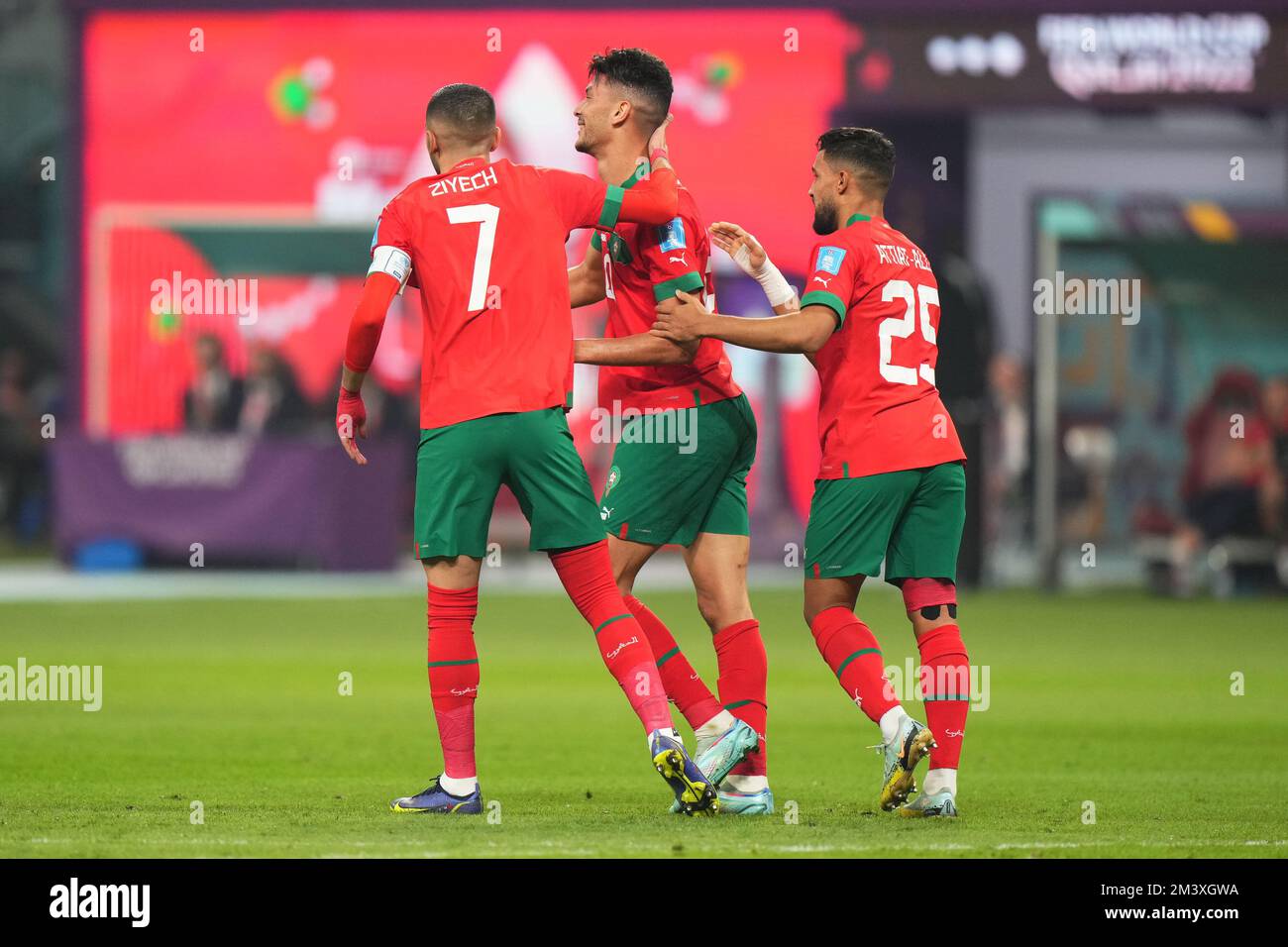 Achraf Dari of Morocco celebrates his goal with his teammates during ...