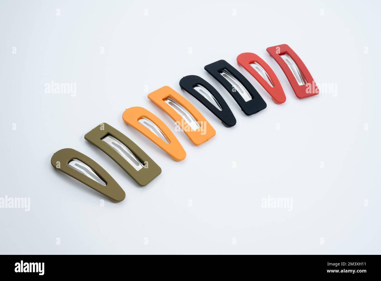 set of two olive yellow black and red hair grips slides styles isolated ...