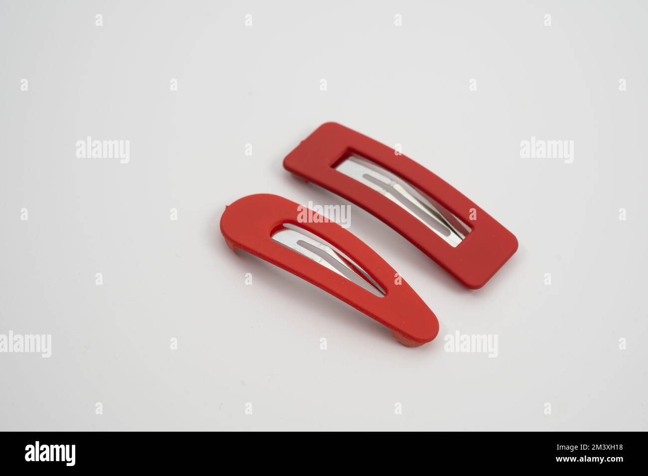 set of two red hair grips slides styles isolated on a white background ...