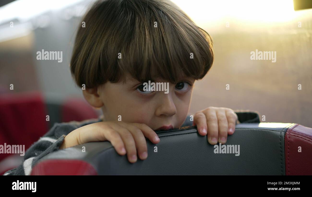 Child standing on train seat traveling inside high speed train. closeup ...