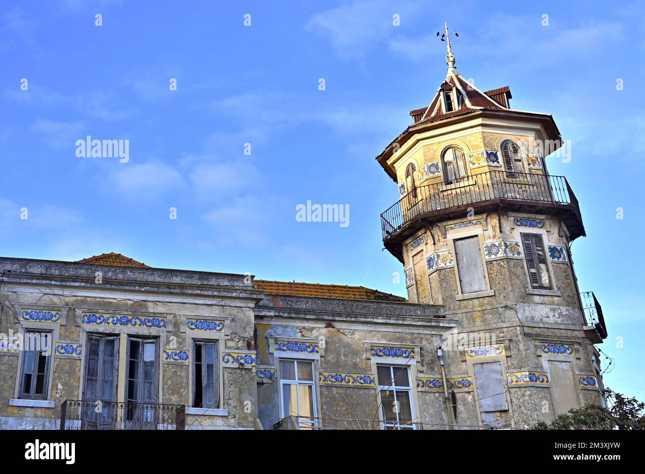 Beautiful octagonal tower with four floors, tiled friezes on facades ...
