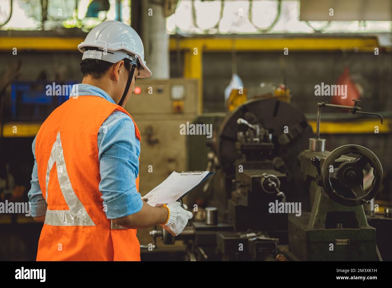 Industry male engineer worker safety check machine service fix setup ...