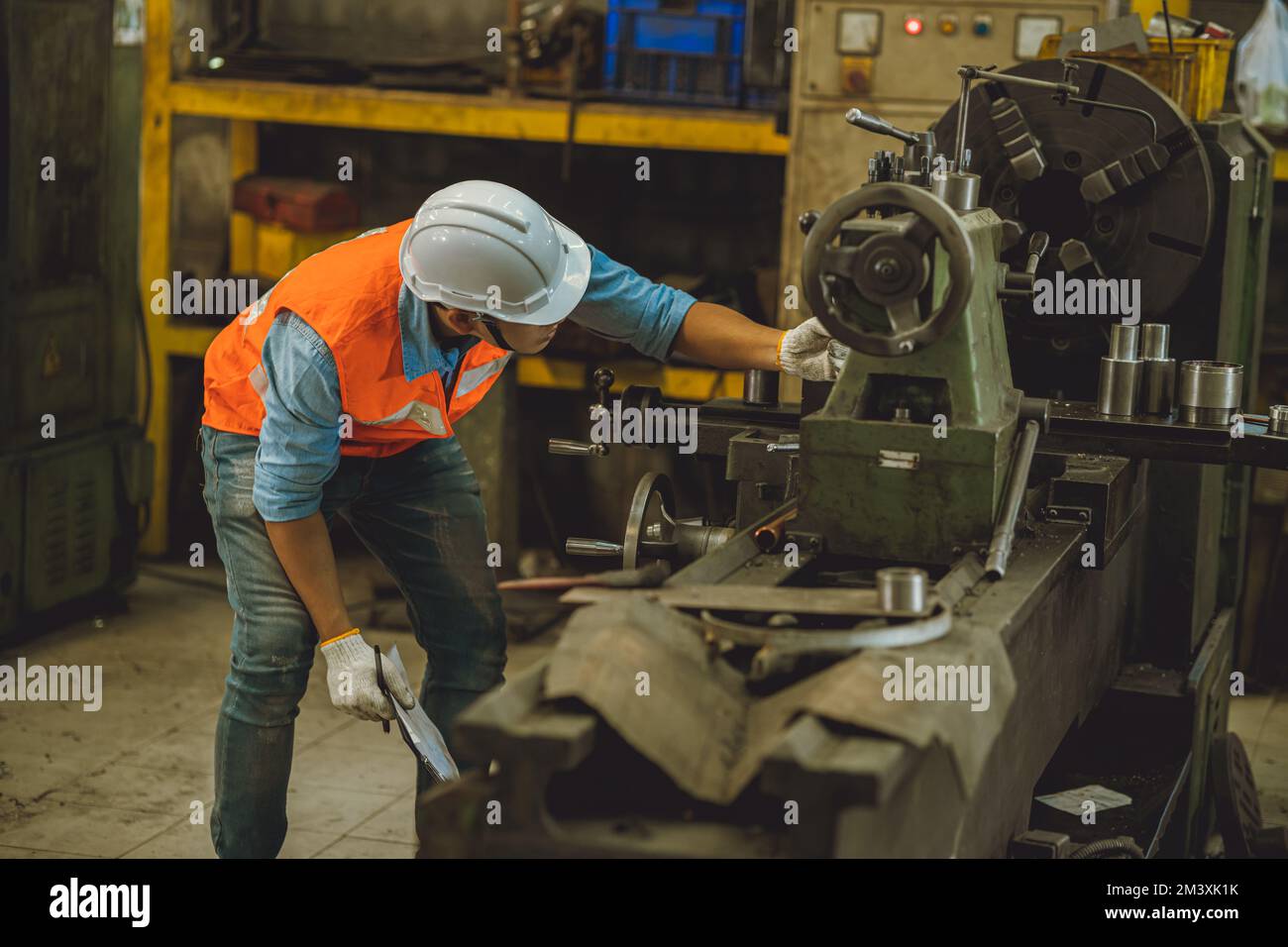 Industry male engineer worker safety check machine service fix setup ...