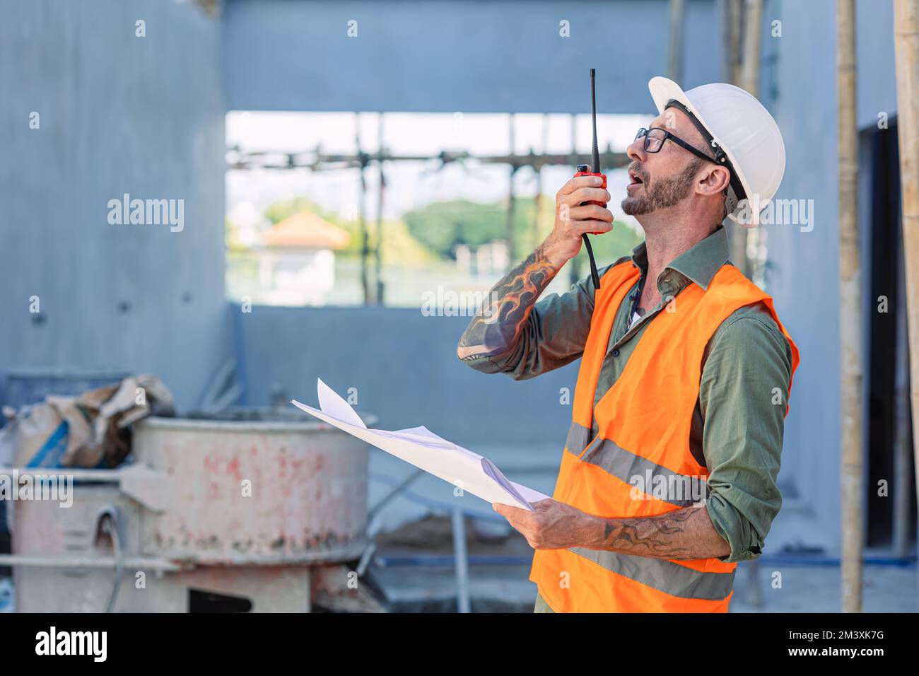 Engineer builder foreman work radio call in construction site ...