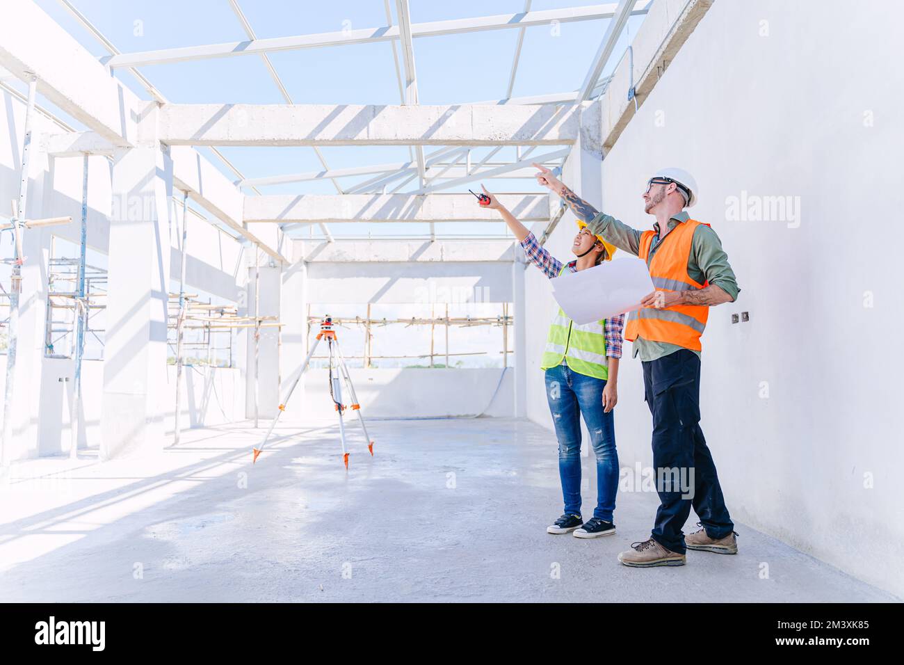 Engineer builder architect team working check progress construction of ...