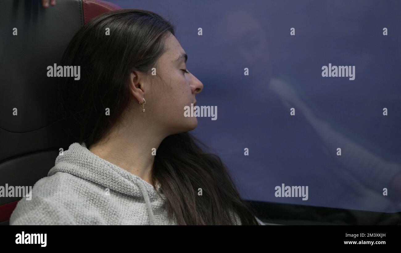 Tired woman closing eyes traveling on high speed train. Sad tearful ...