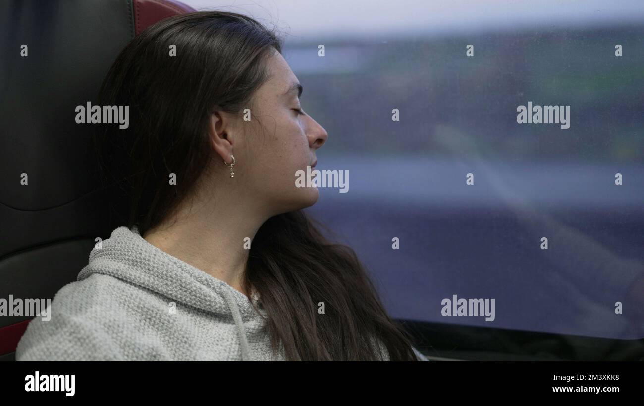 Tired woman closing eyes traveling on high speed train. Sad tearful ...