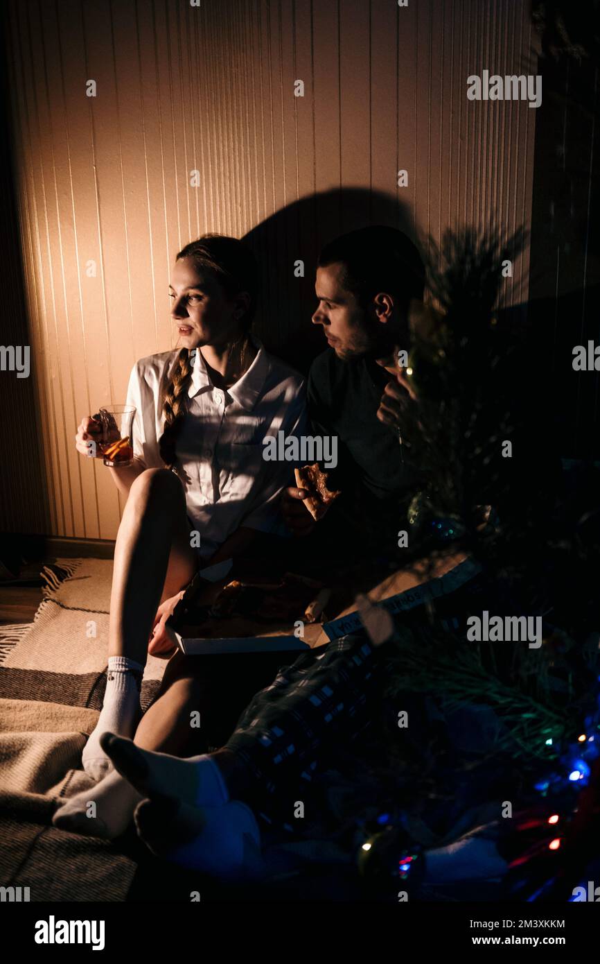 Valentines day home date ideas. Young couple in love celebrating ...