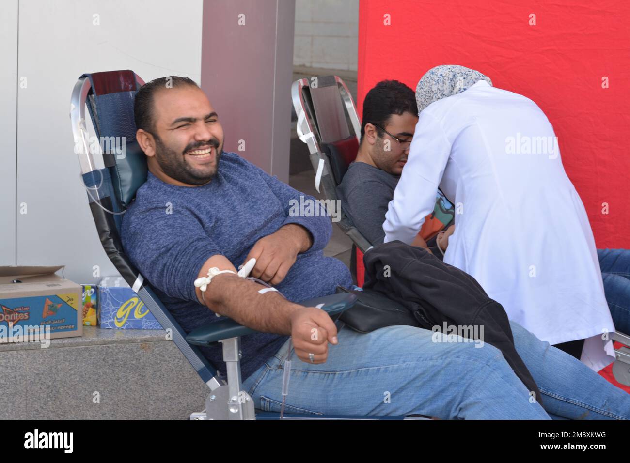 Cairo, Egypt, December 13 2022: collecting blood from blood volunteer ...