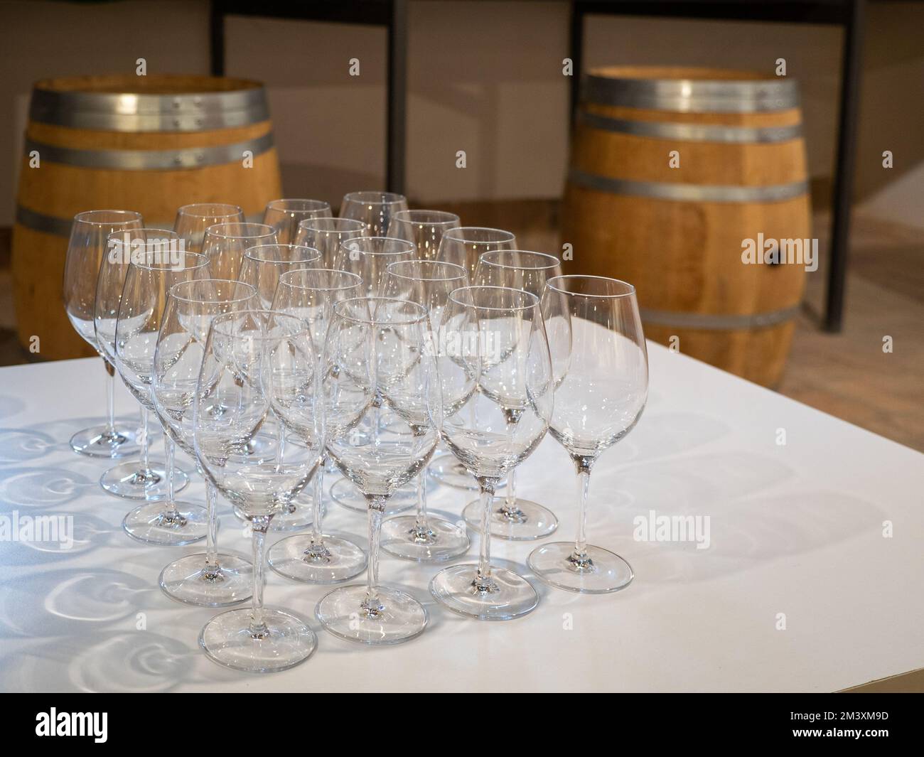The wine glasses arranged in a row on a table with white tablecloth ...
