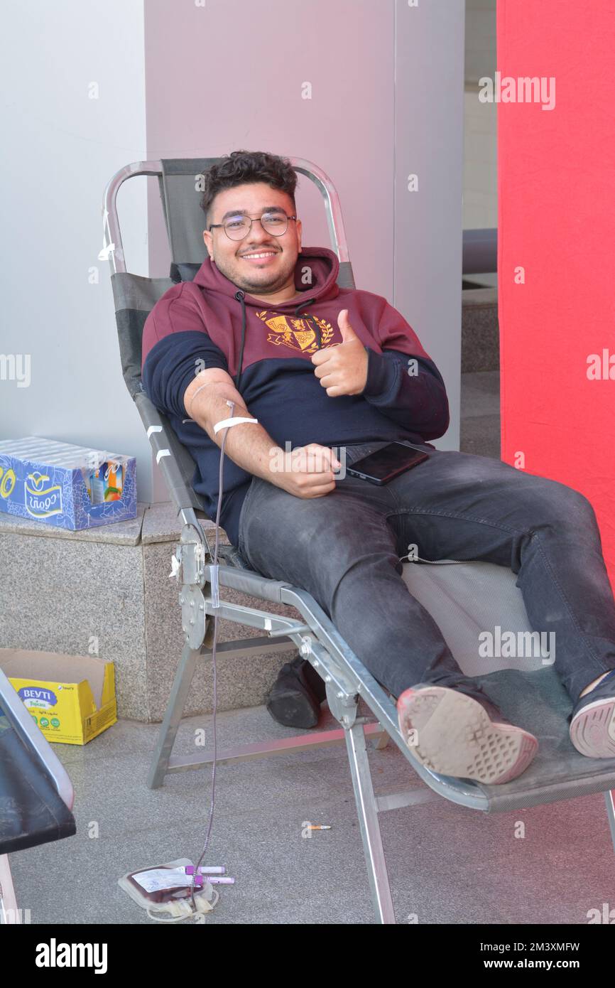 Cairo, Egypt, December 13 2022: collecting blood from blood volunteer ...