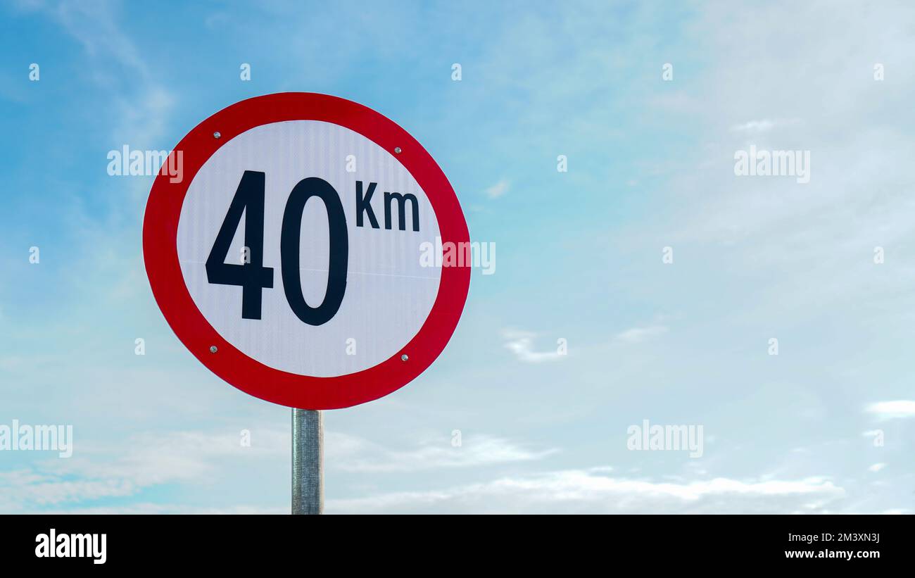 40km limit traffic sign on the road with copy space. 40km/h speed limit ...