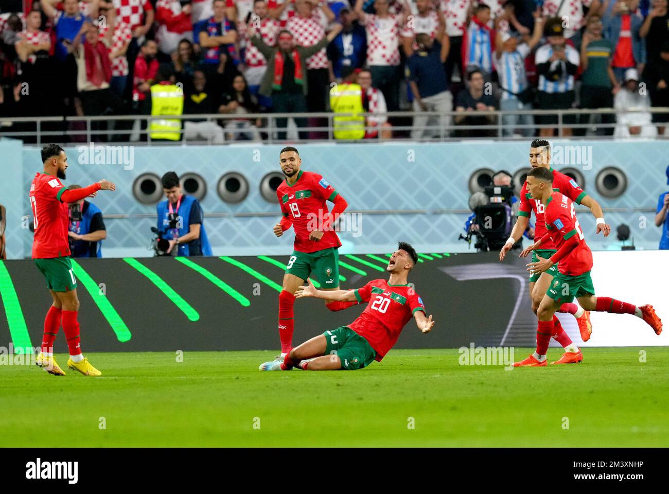 Morocco's Achraf Dari (centre) celebrates scoring their side's first ...