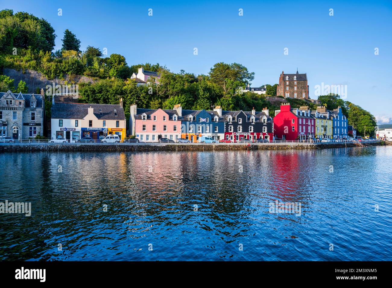Early evening light and colourful reflections of houses on the ...