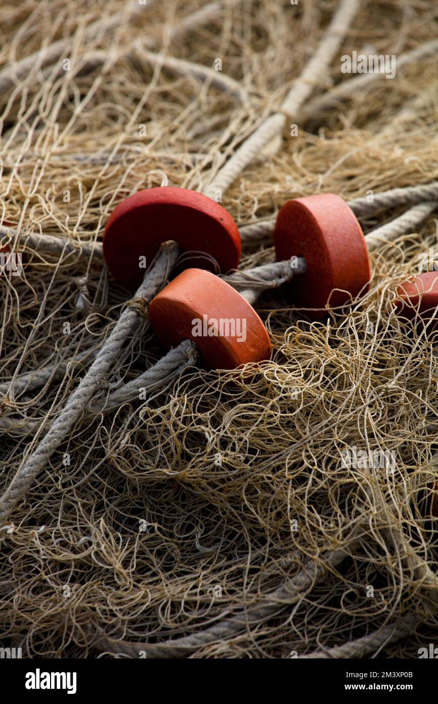longline fishing net, sand color with red orange and yellow details ...