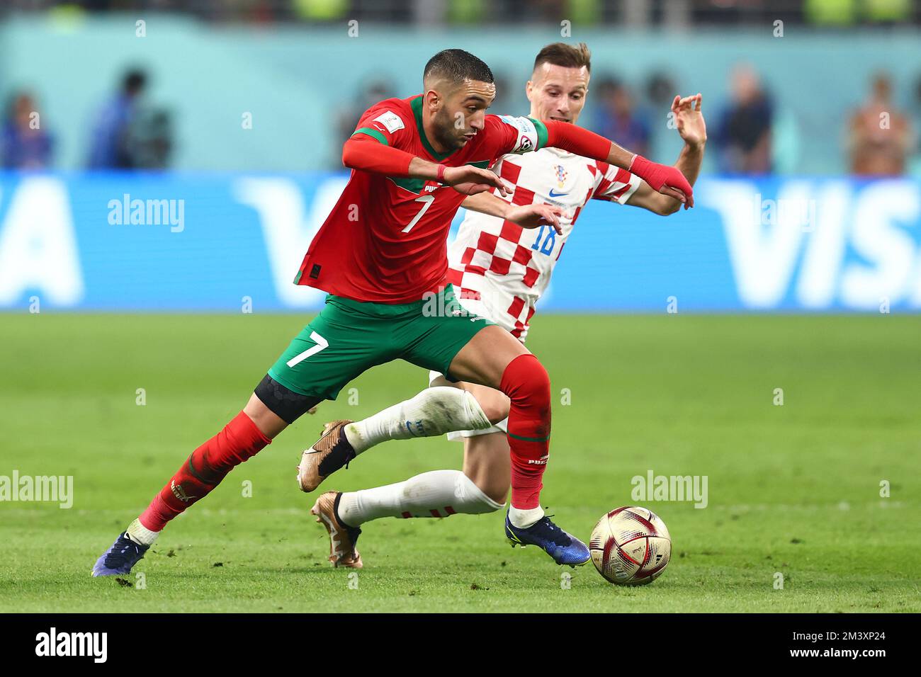 Doha, Qatar. 17th Dec, 2022. Mislav Orsic (R) of Croatia in action with ...