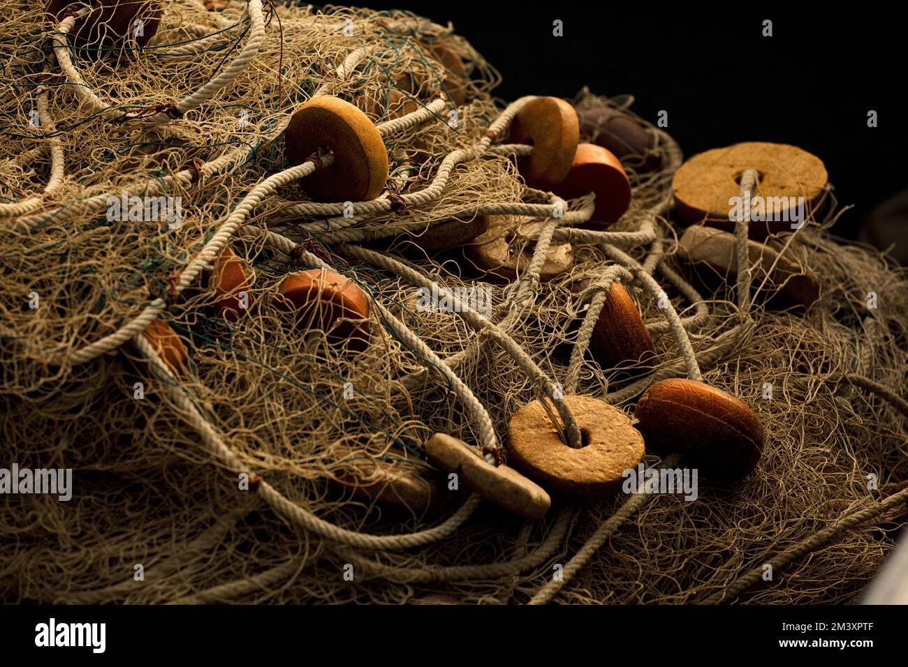 longline fishing net, sand color with red orange and yellow details ...