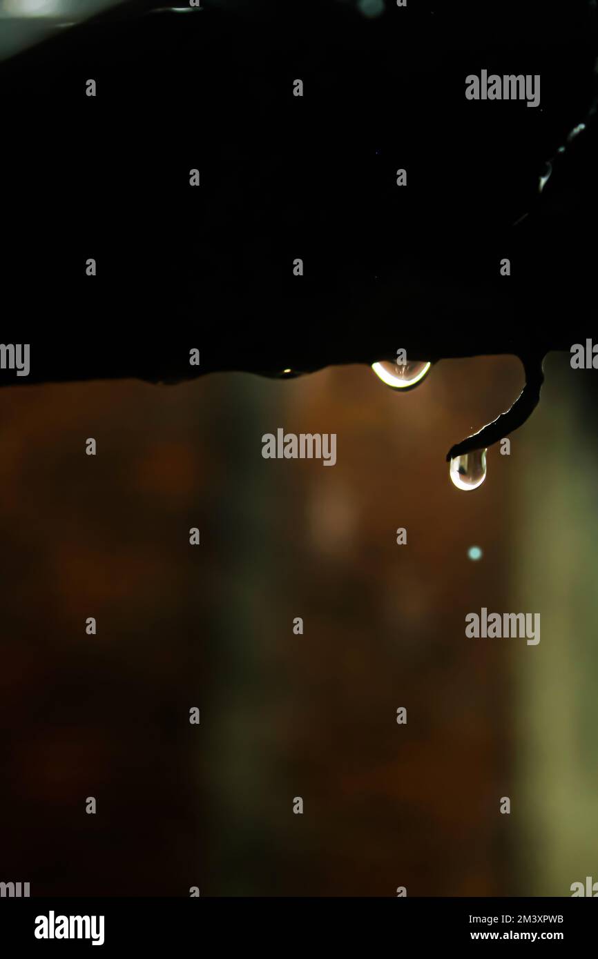 A vertical shot of raindrops water detail in balcony Stock Photo - Alamy