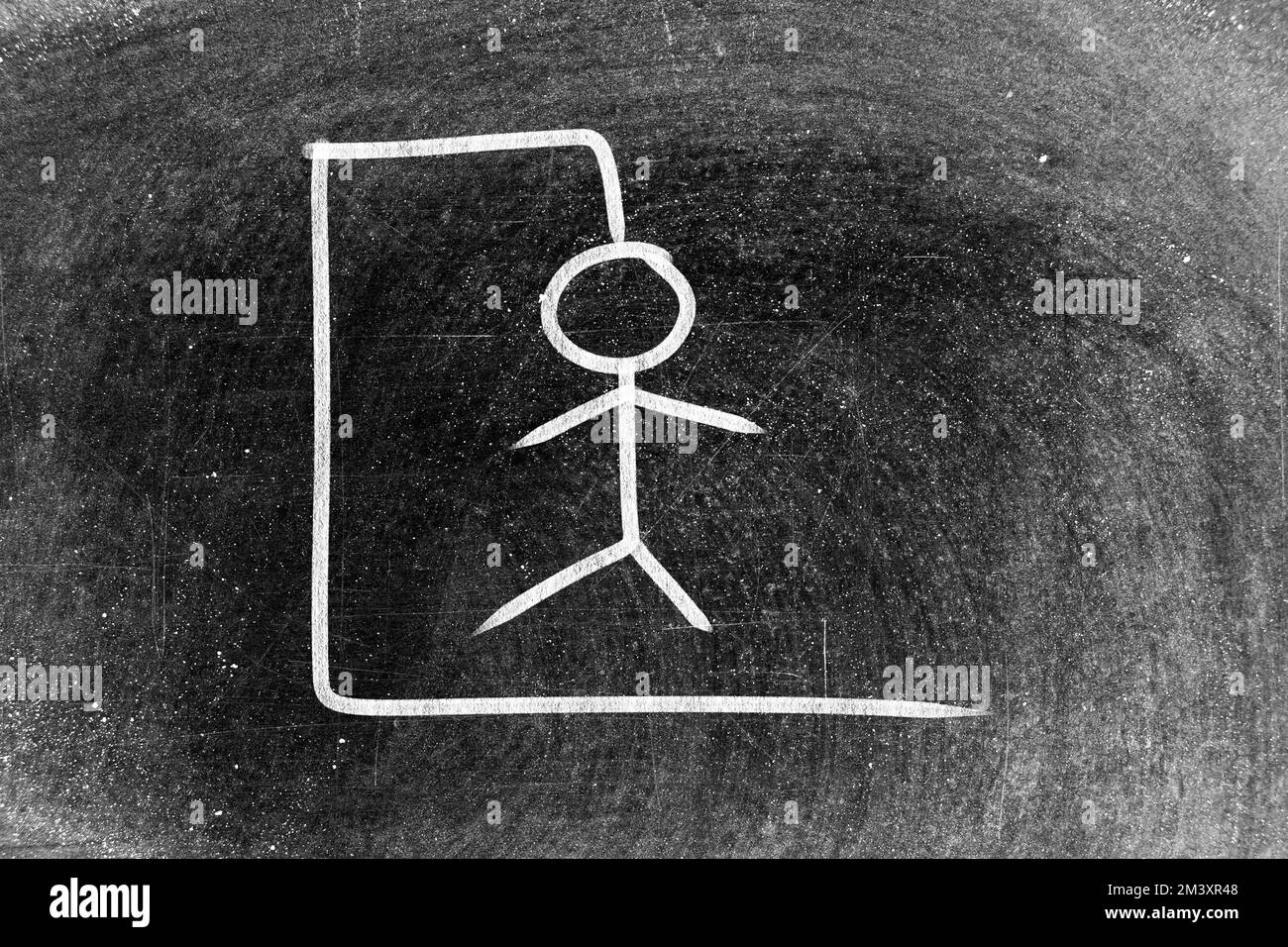 White chalk hand writing in hangman shape on blackboard background ...