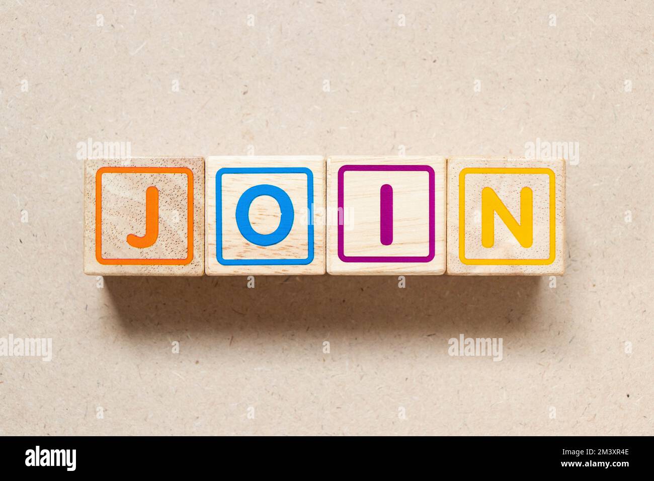 Color letter block in word join on wood background Stock Photo - Alamy