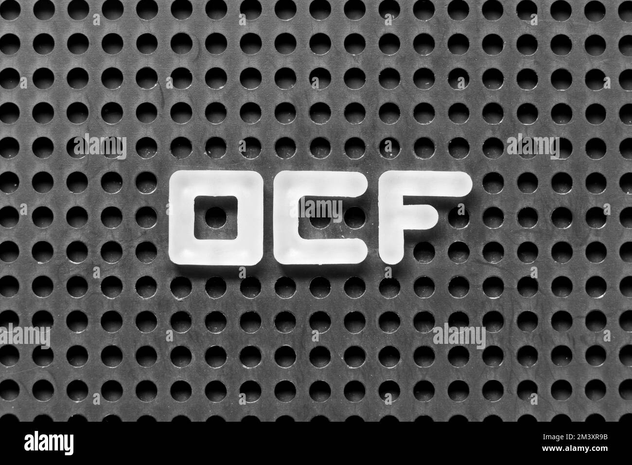 White alphabet letter in word OCF (Abbreviation of Operating cash flow ...