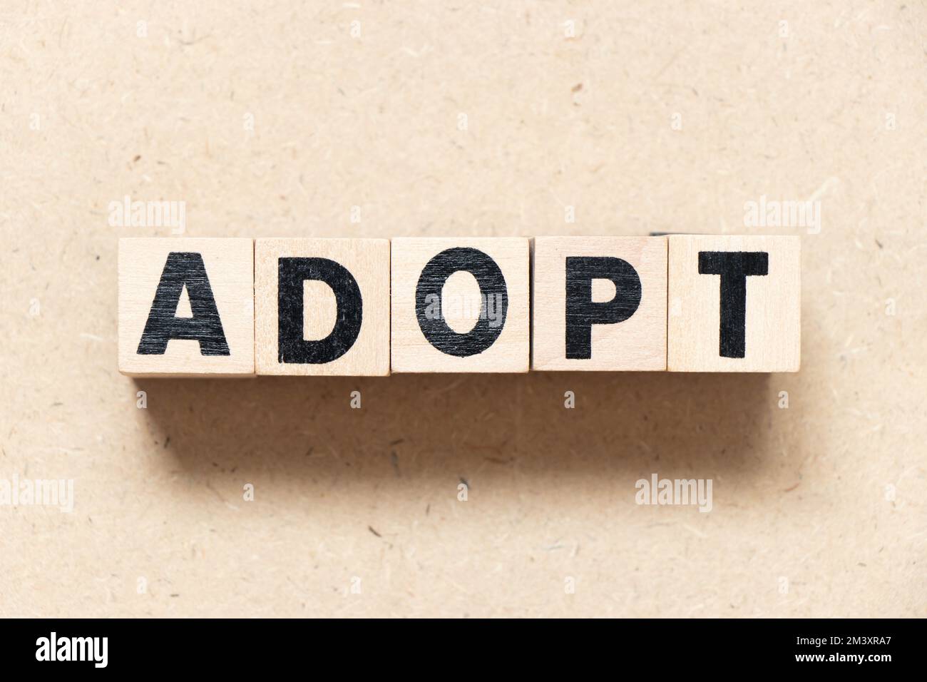 Alphabet letter block in word on adopt wood background Stock Photo - Alamy