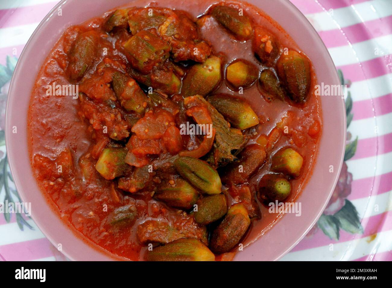 African lady cooking stew hi-res stock photography and images - Alamy