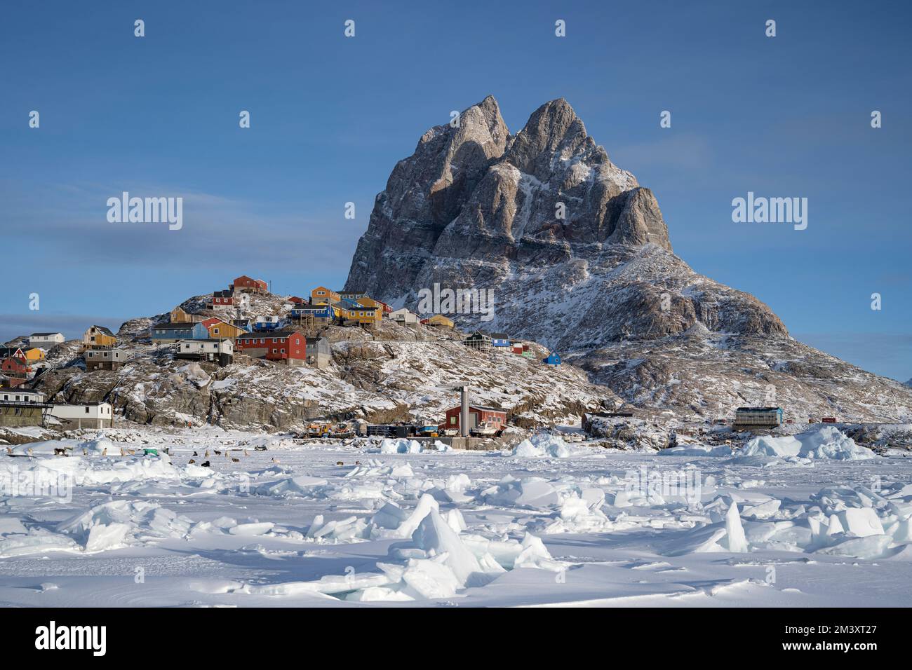 Fishing boats on the sea ice in Uummannaq harbour in west Greenland ...