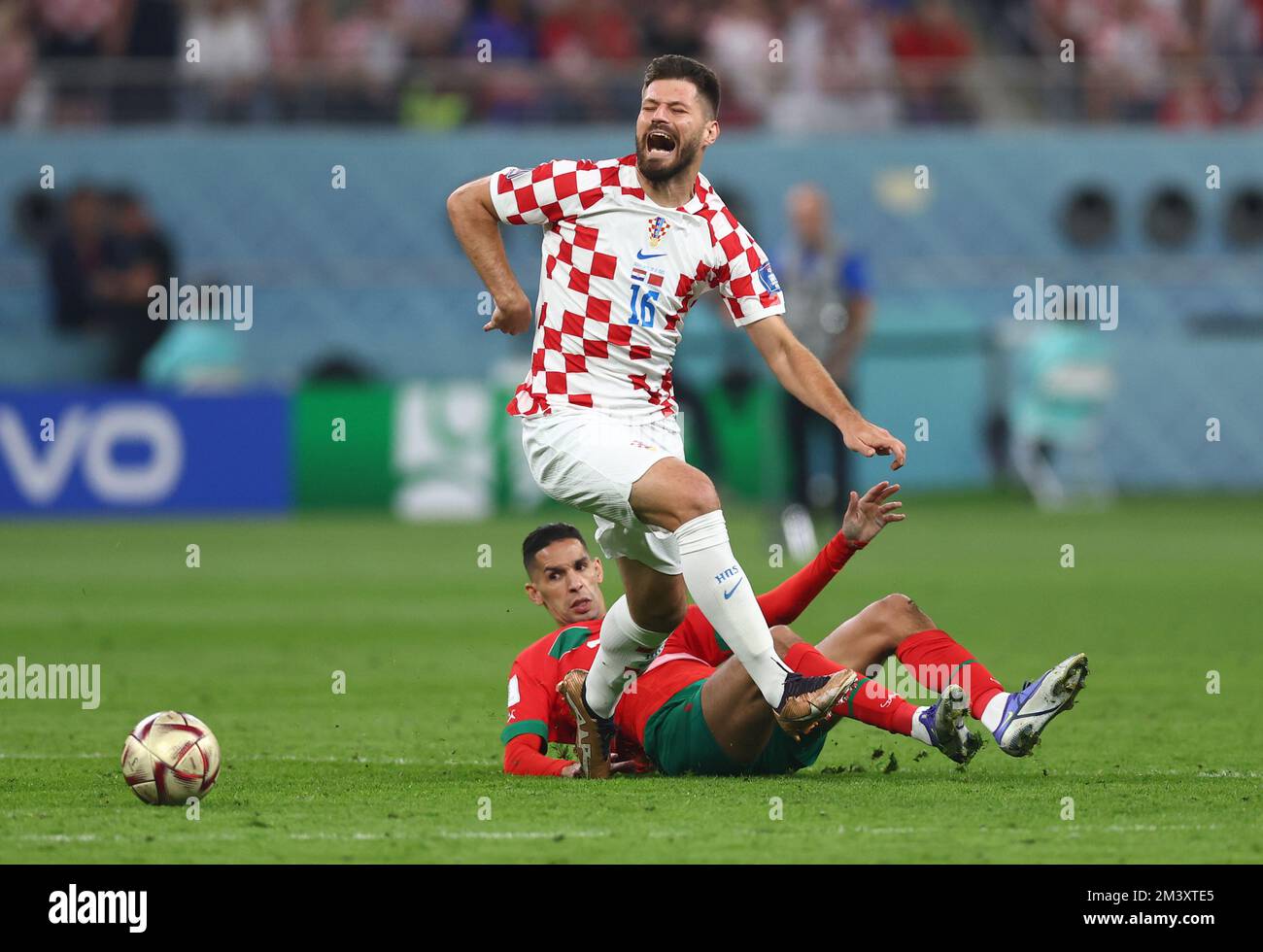 Doha, Qatar. 17th Dec, 2022. Bruno Petkovic of Croatia tackled by ...
