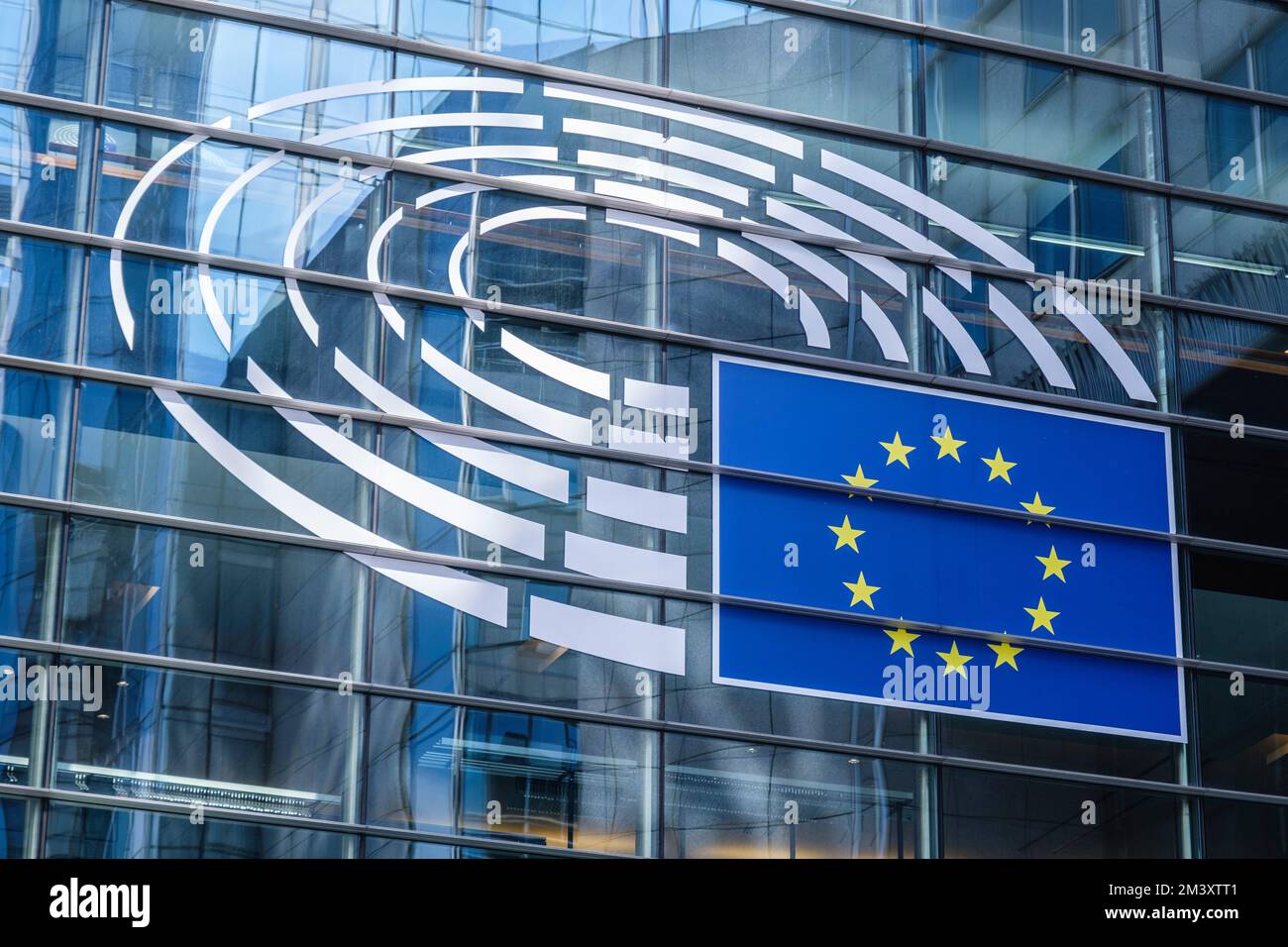 The european parliament facade and its stylised hemicycle logo with the ...