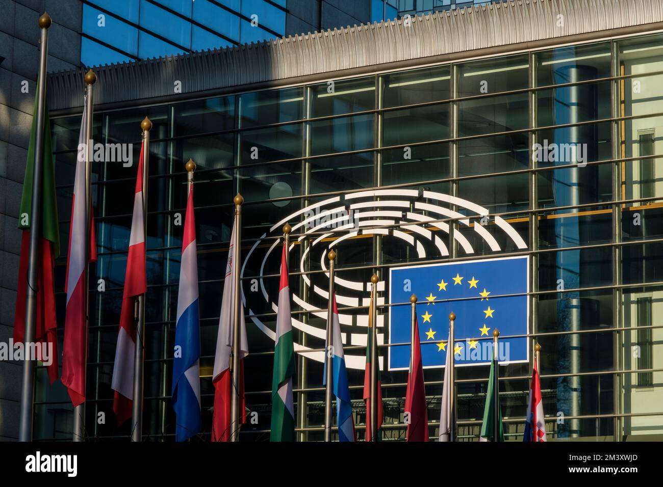 The european parliament facade and its stylised hemicycle logo with the ...