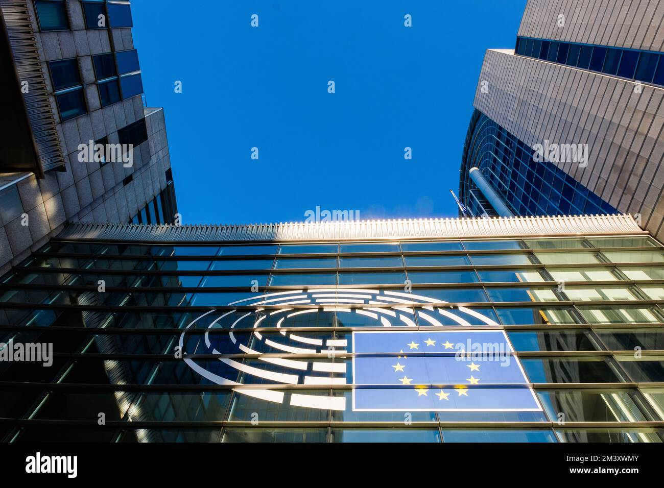 The european parliament facade and its stylised hemicycle logo with the ...