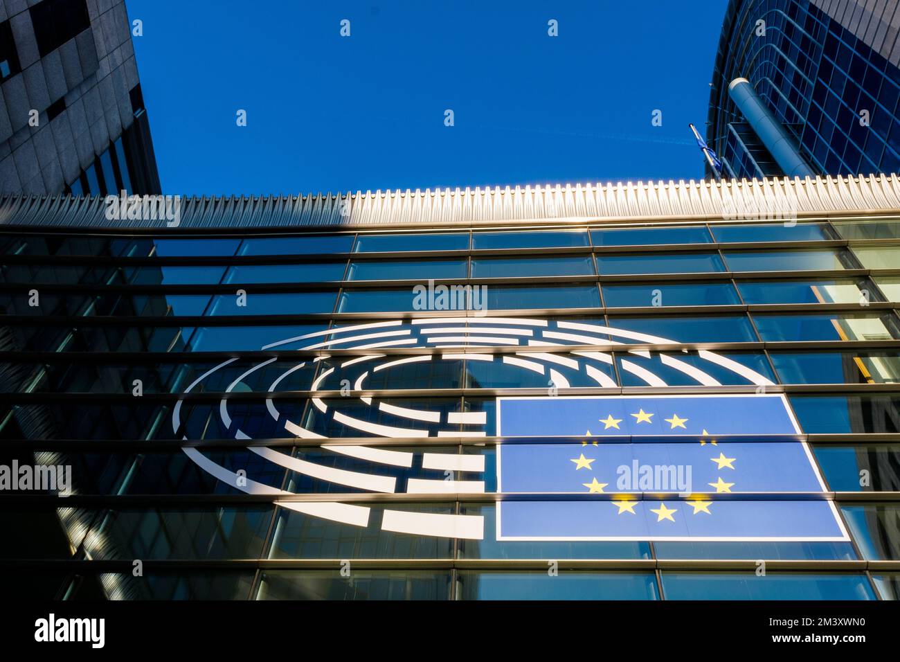 The european parliament facade and its stylised hemicycle logo with the ...