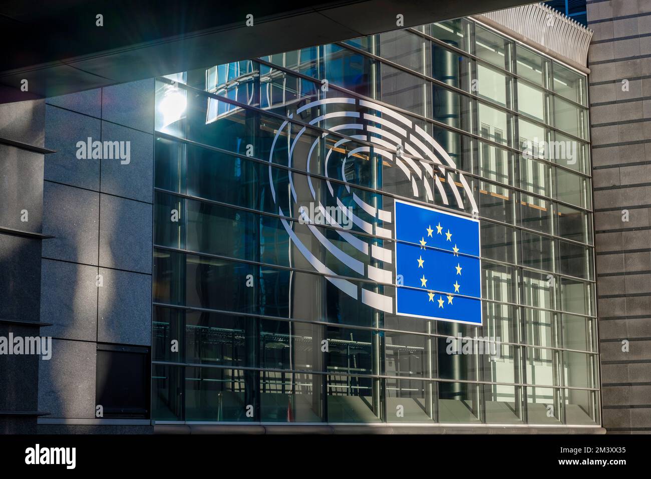 The european parliament facade and its stylised hemicycle logo with the ...