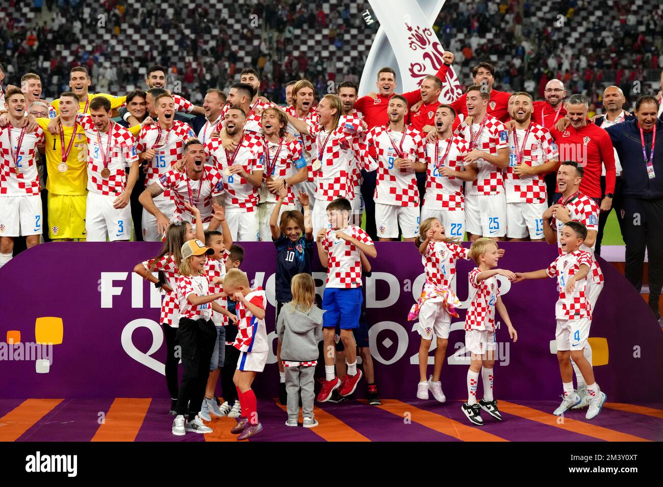 Croatia players and staff members celebrate with their medals after ...
