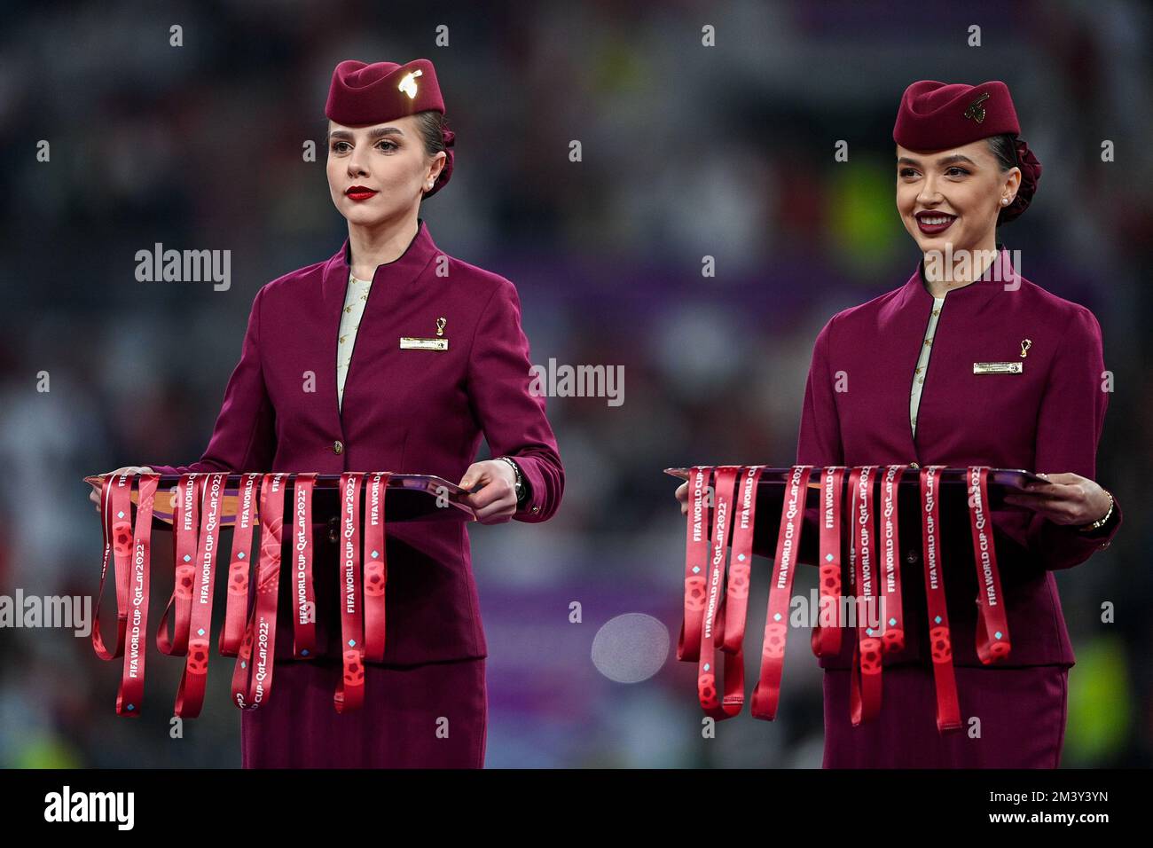 DOHA, QATAR - DECEMBER 17: Two employees of Qatar Airways are seen with ...