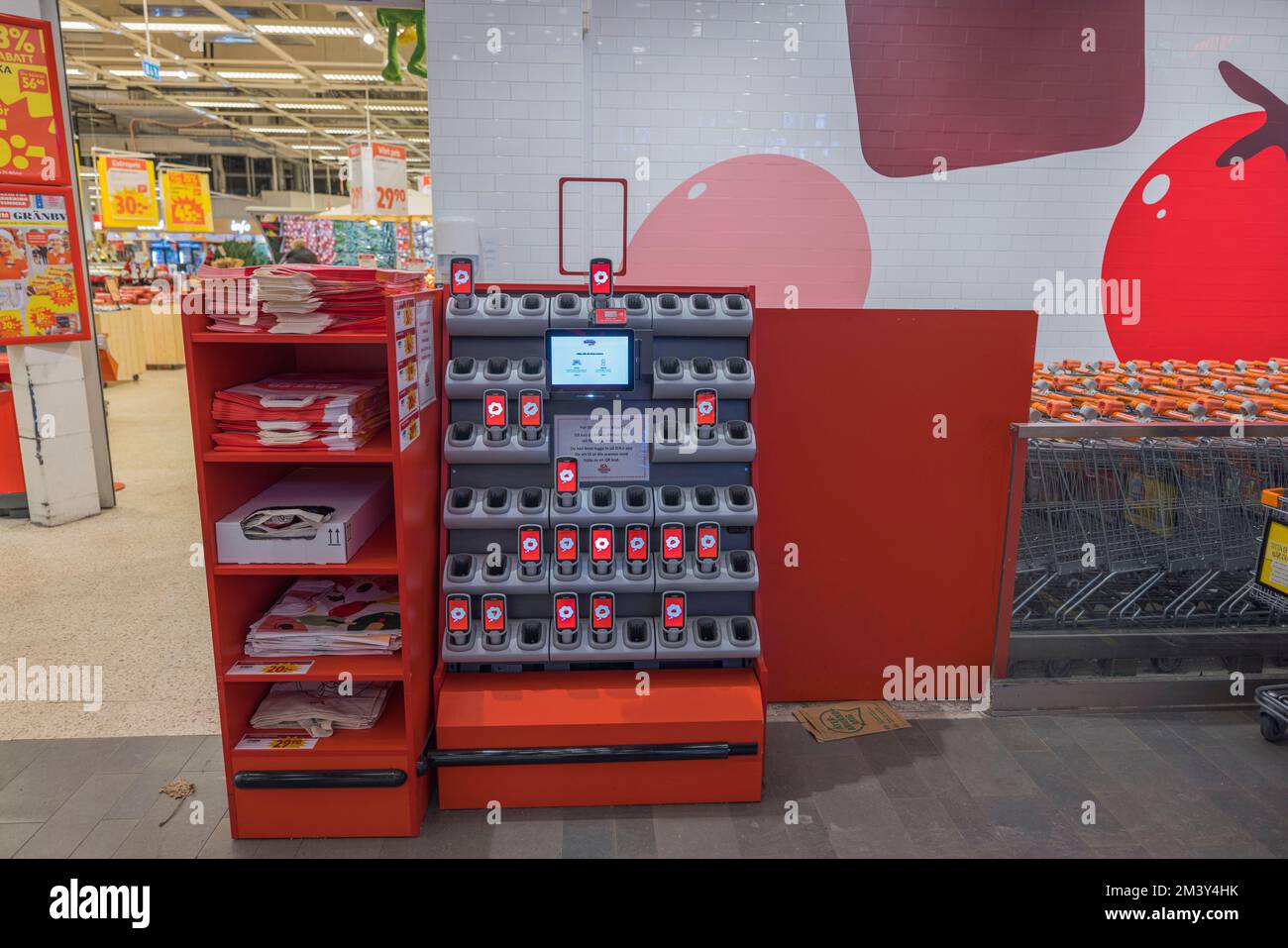 Interior view of ICA supermarket. Stand with customer scanners and ...