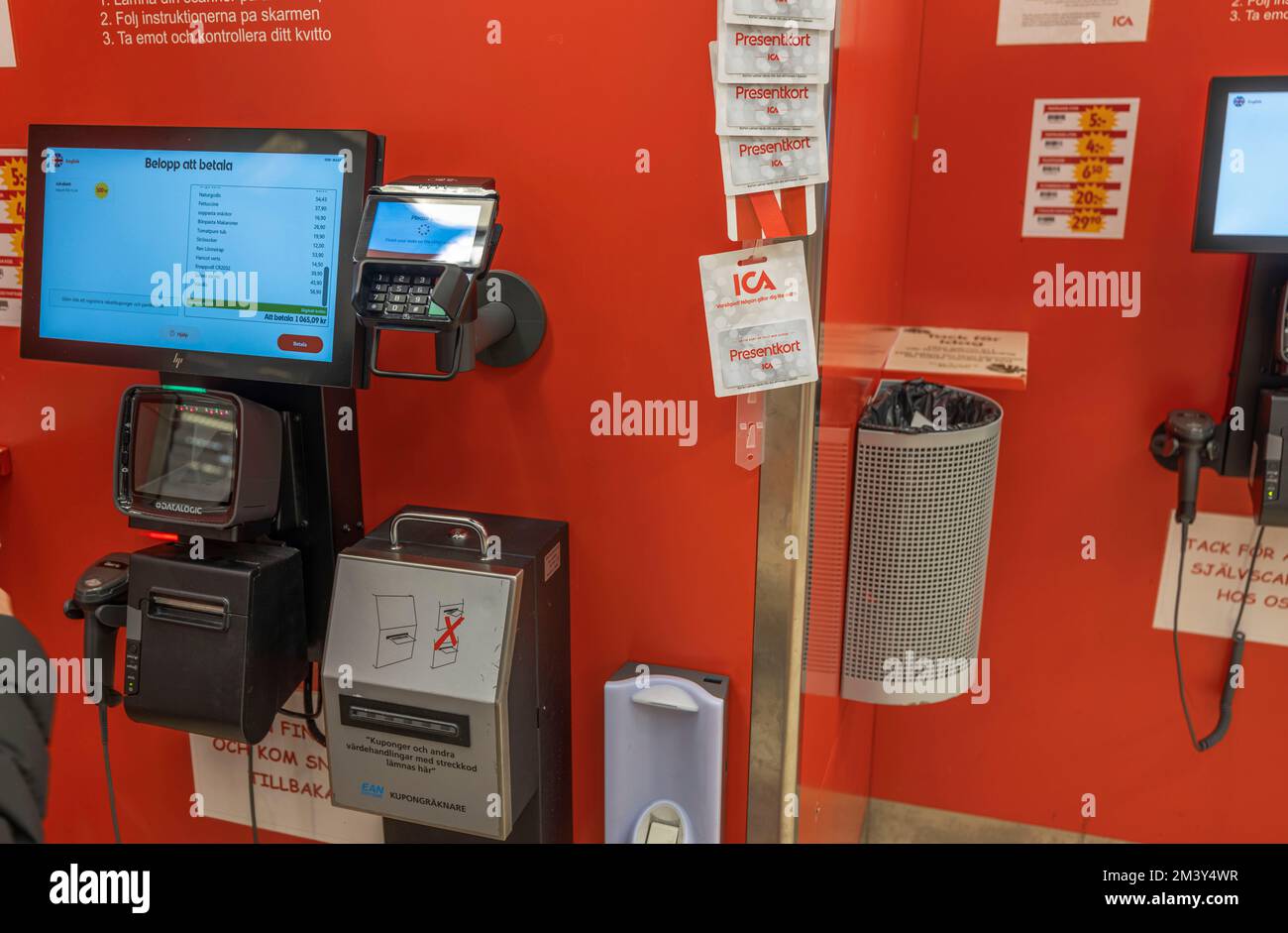Close up view of payment for goods at payment terminal by scanning with ...