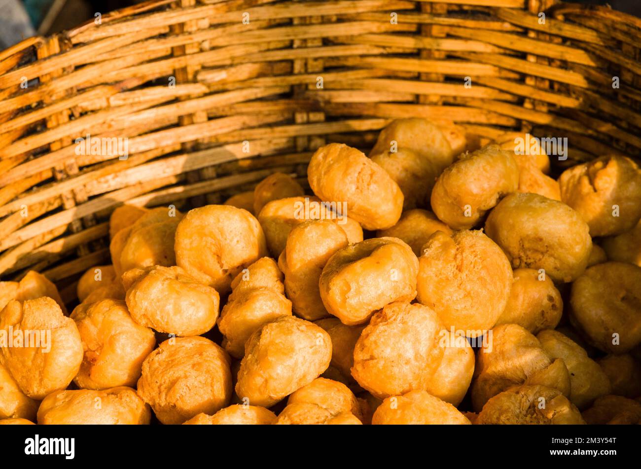Small fried breads are a streetfood speciality Stock Photo - Alamy