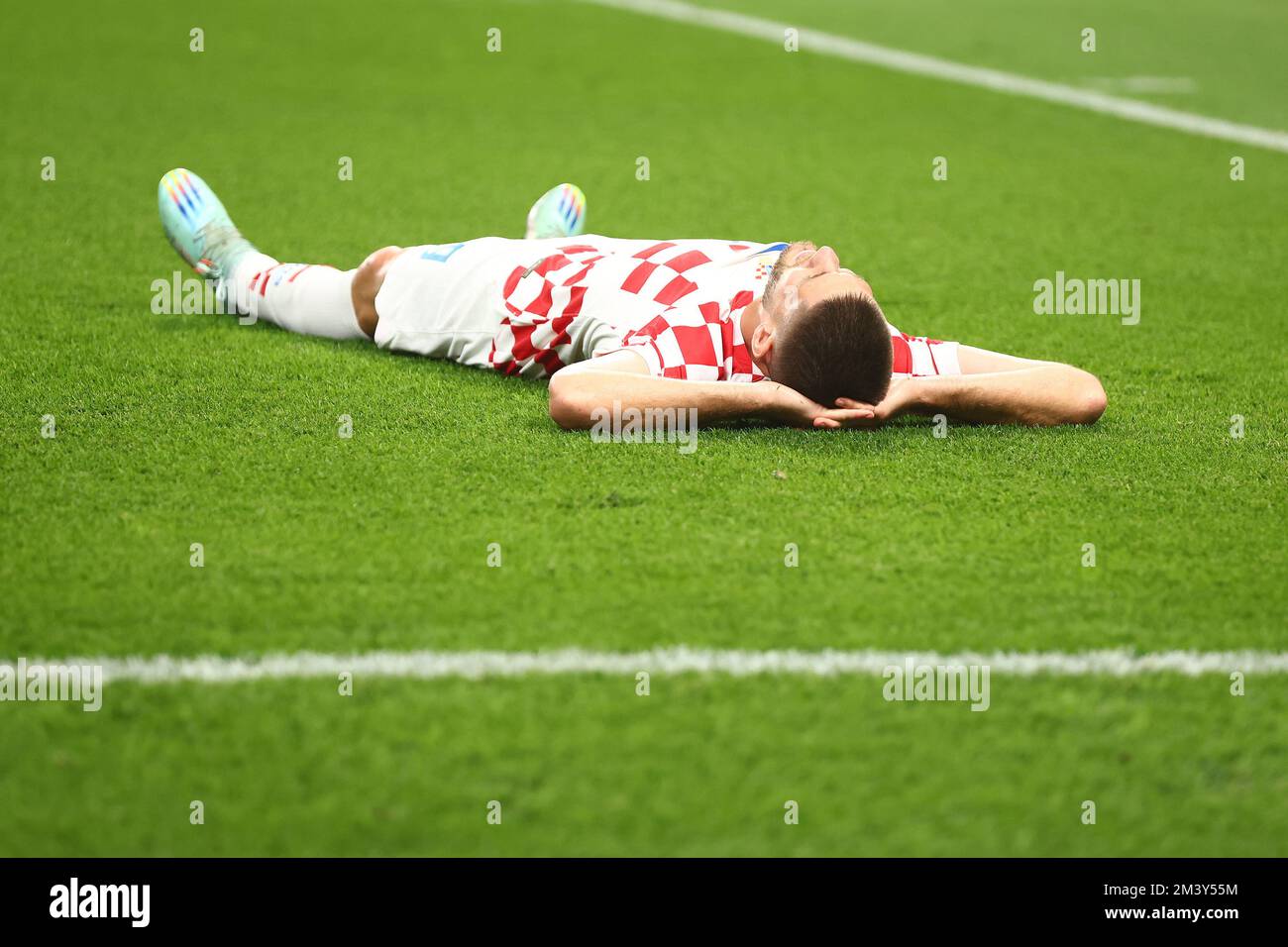Doha, Qatar. 17th Dec, 2022. Andrej Kramaric of Croatia lies injured ...