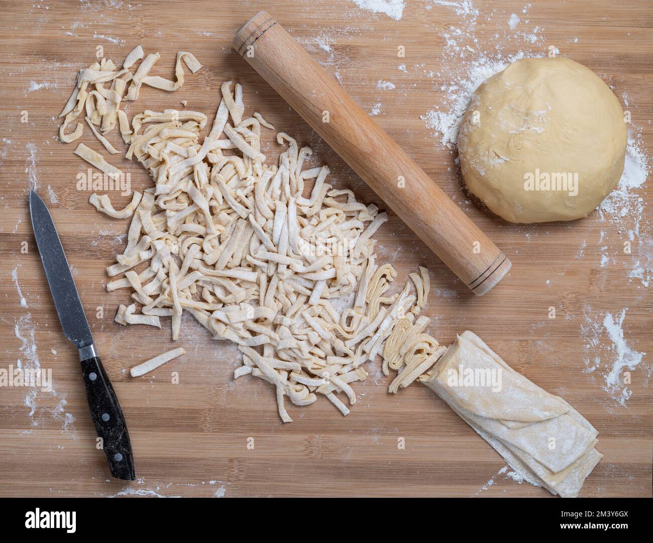 Making homemade noodles at home in the kitchen from scratch by hand ...