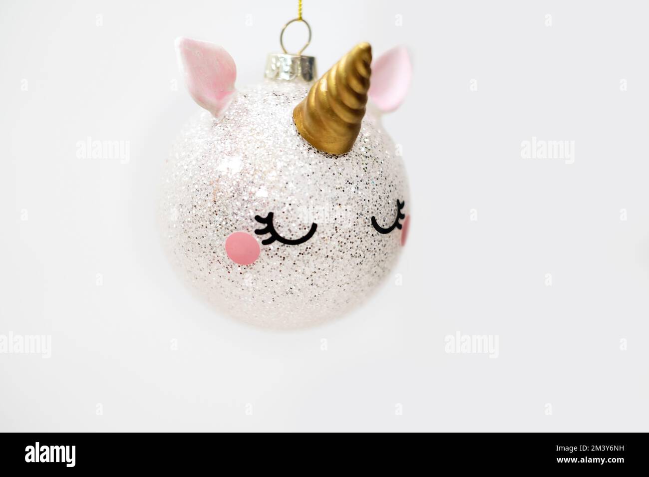 Christmas tree bauble shaped like unicorn on white background Stock ...