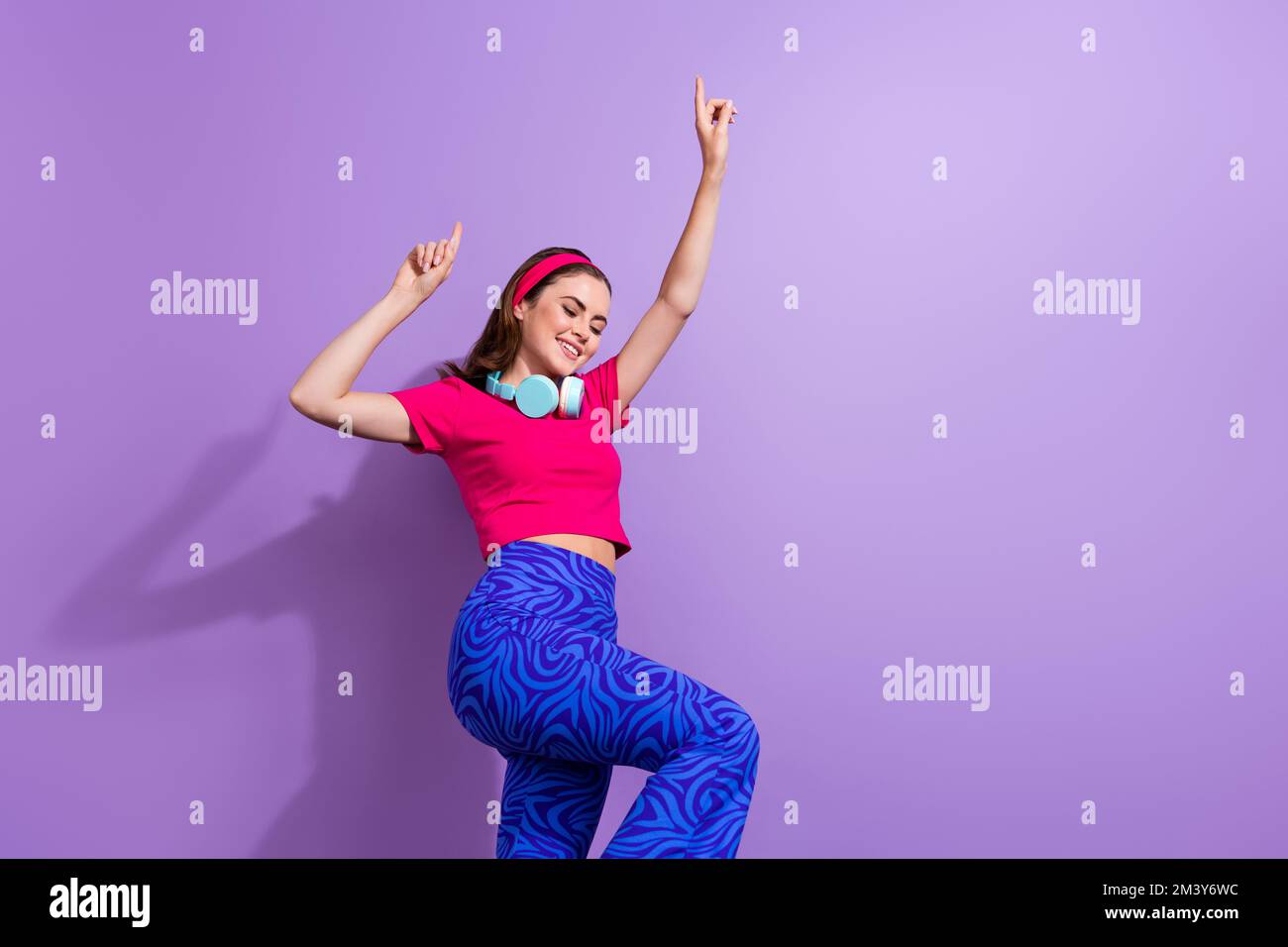 Portrait of overjoyed pretty lady pointing fingers partying dancing ...