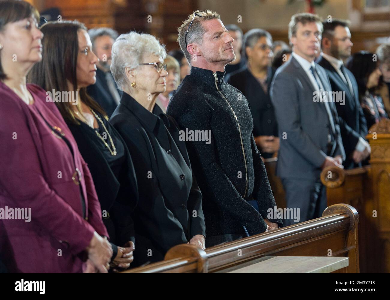 Family members of Jean Lapointe look on during his funeral in Montreal ...