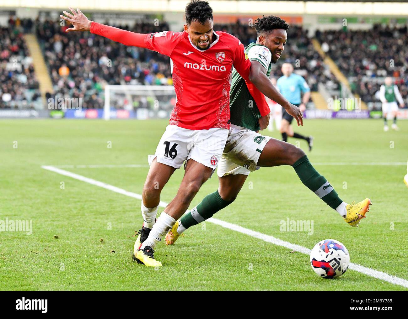 Plymouth Argyle forward Niall Ennis (11) battles for the ball with ...
