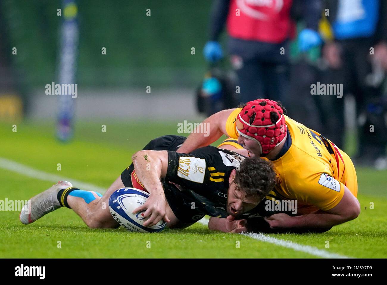 La Rochelle's Tawera Kerr-Barlow is tackled by Ulster Rugby's Tom ...